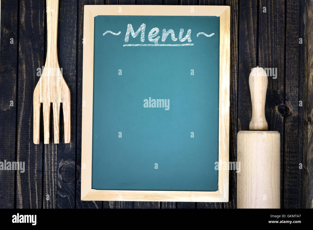 Kitchen utensils and menu on wooden table Stock Photo - Alamy