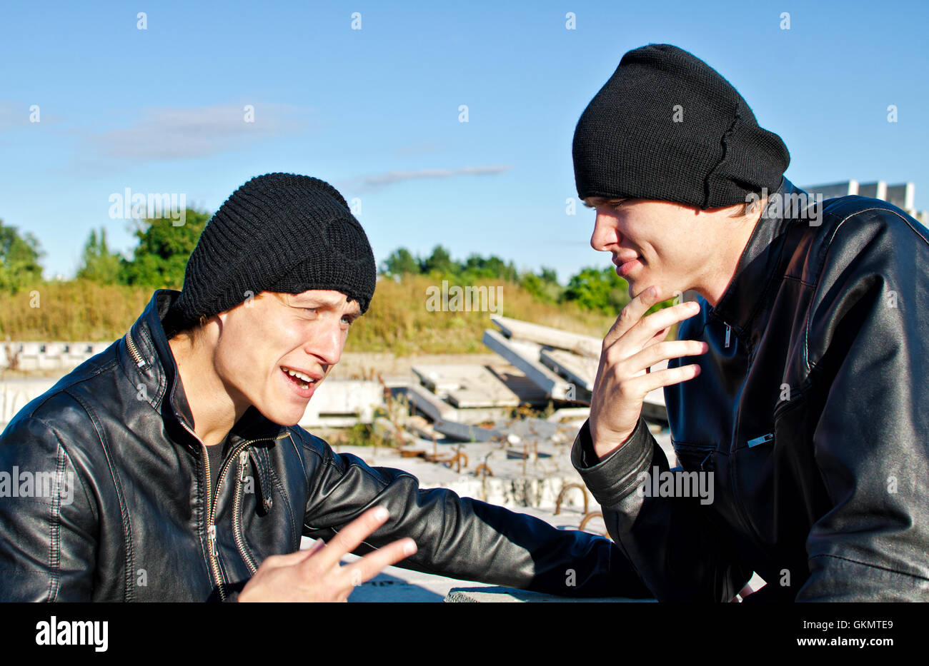Two criminals discussing robbery plan Stock Photo - Alamy