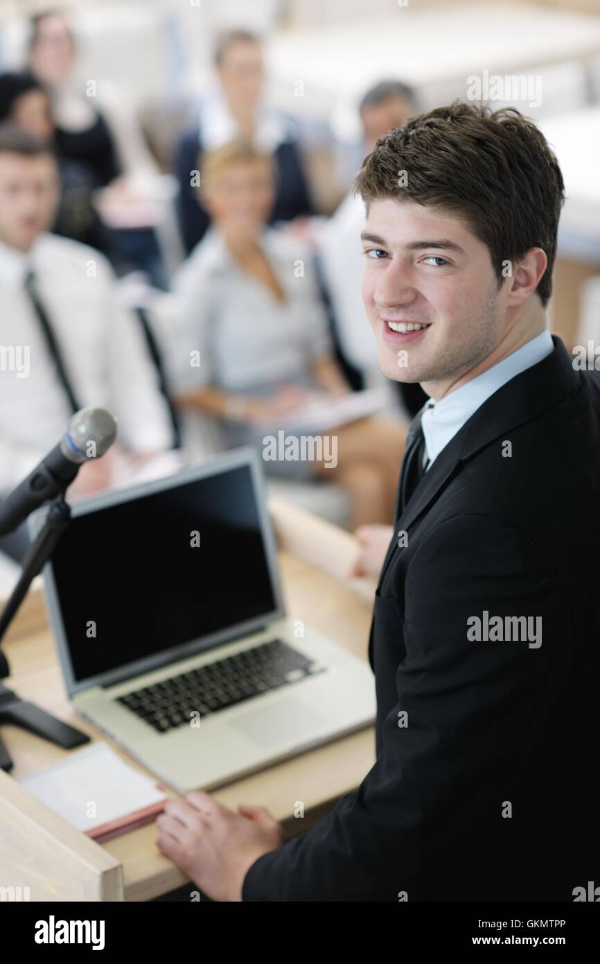 Young business man giving a presentation on conference Stock Photo - Alamy