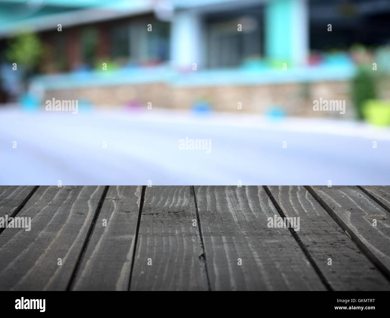 Empty wooden table and cafe outdoor Stock Photo - Alamy