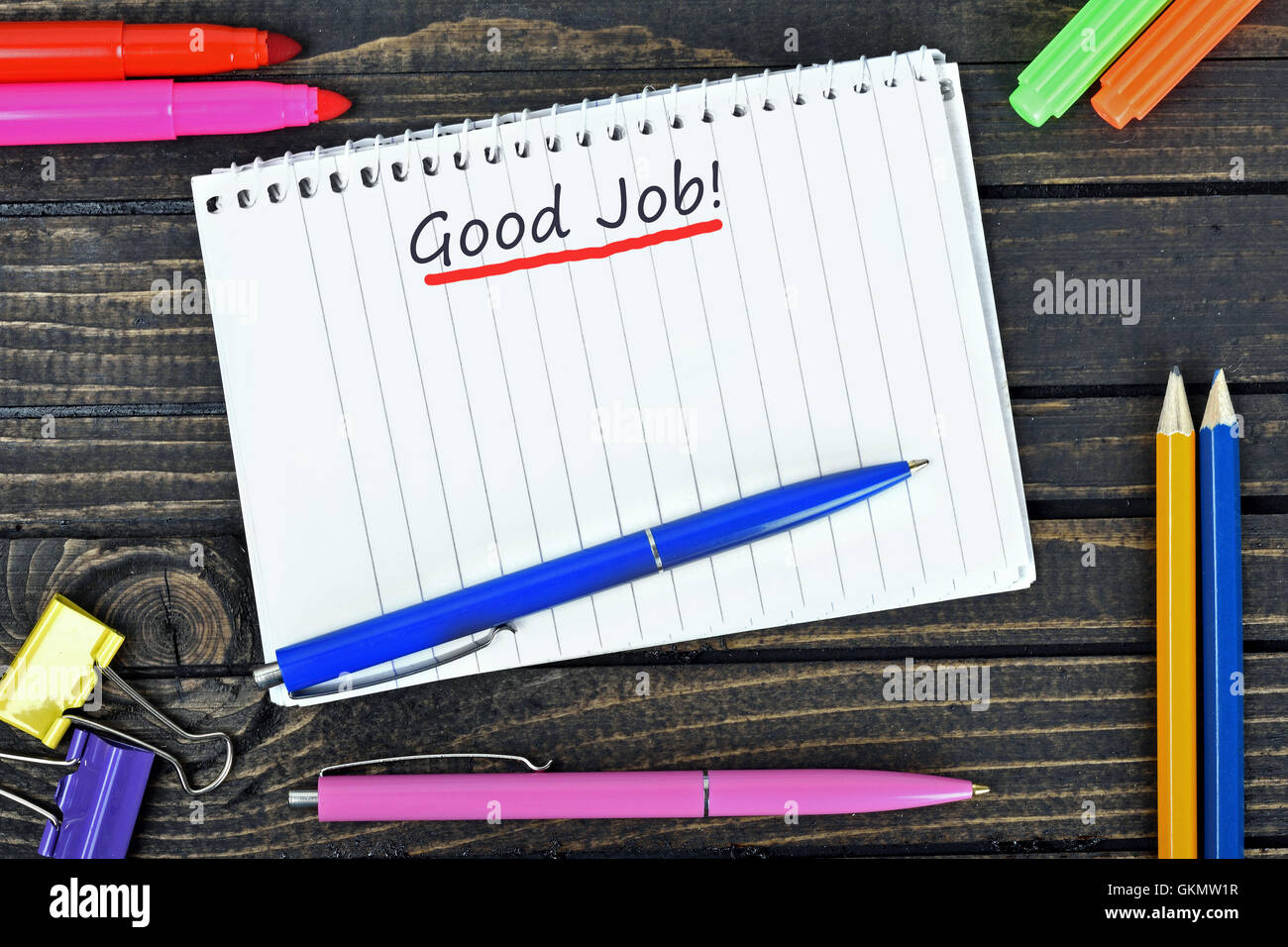 Good Job text on notepad and office tools on wooden table Stock Photo ...