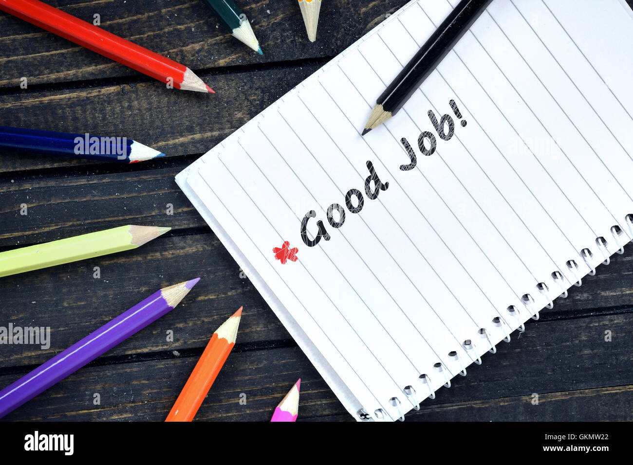 Good Job text on notepad and colorful pencils Stock Photo - Alamy