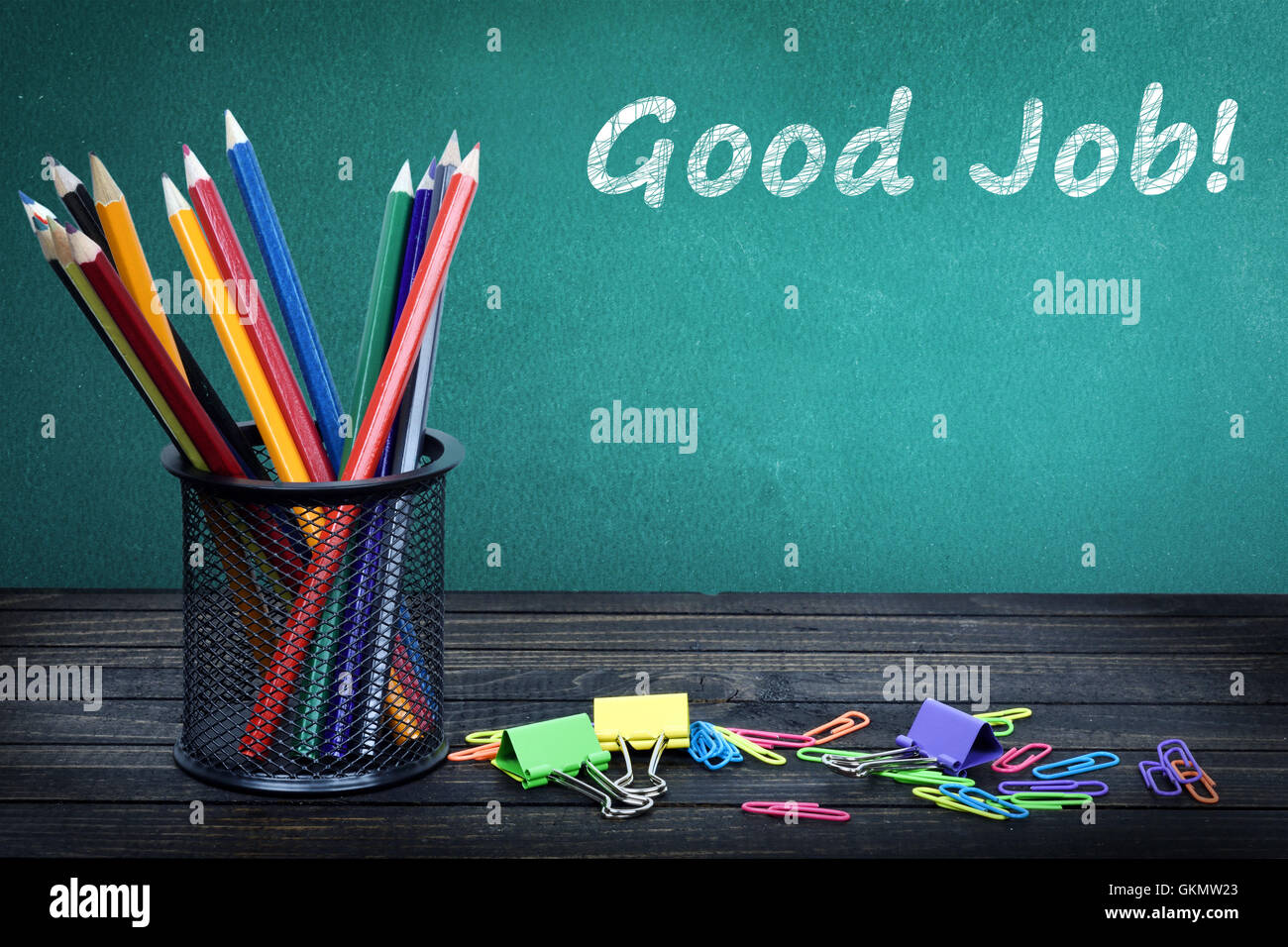 Good job text on green board and group of pencils Stock Photo - Alamy