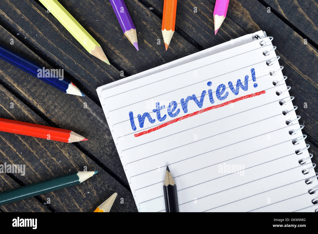Interview text on notepad and colorful pencils Stock Photo - Alamy