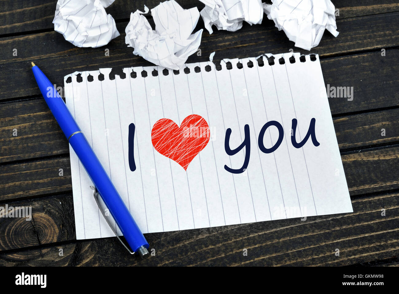 I love you text on notepad and crippled paper Stock Photo - Alamy