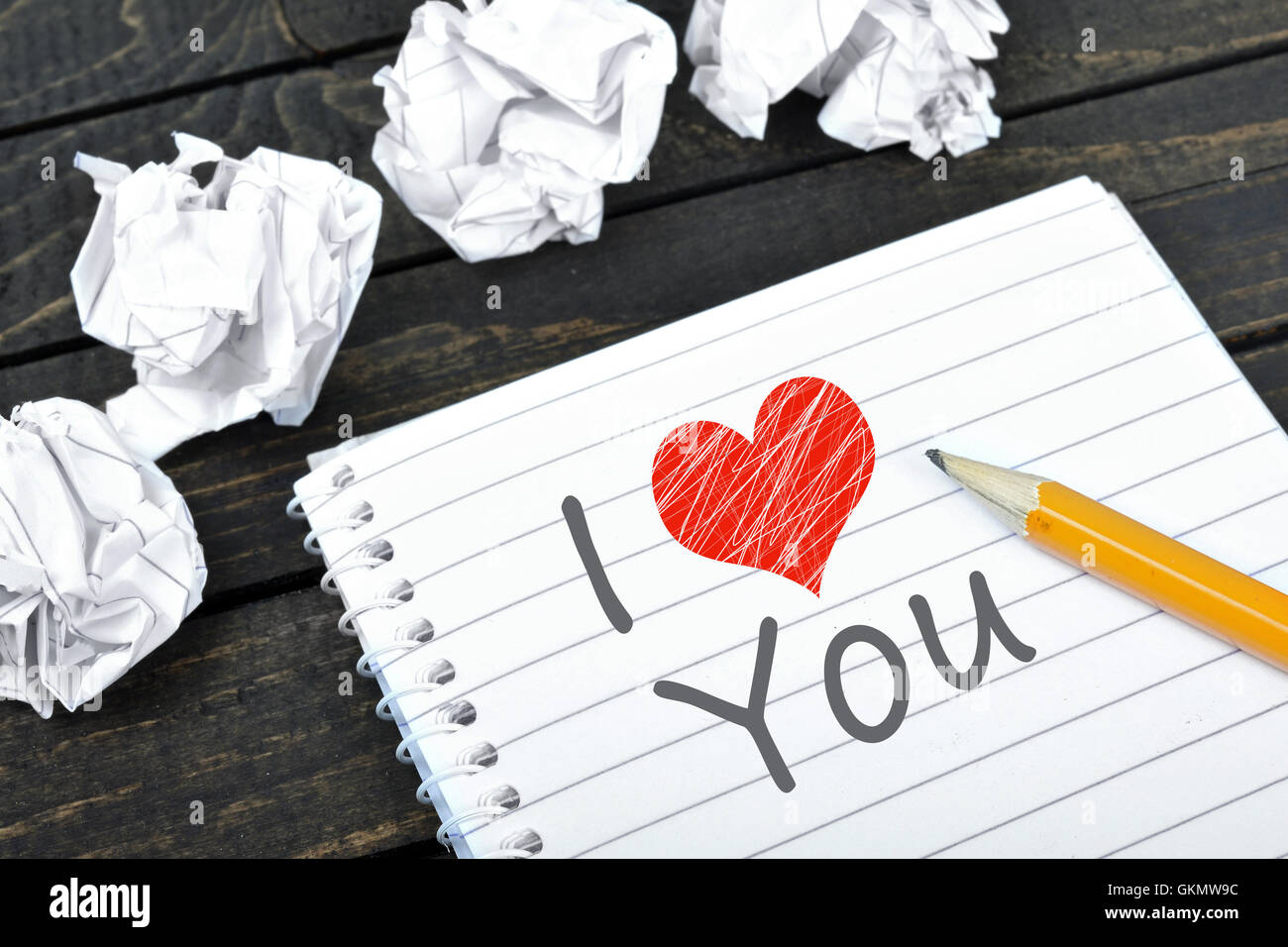 I love you text on notepad and crippled paper Stock Photo - Alamy