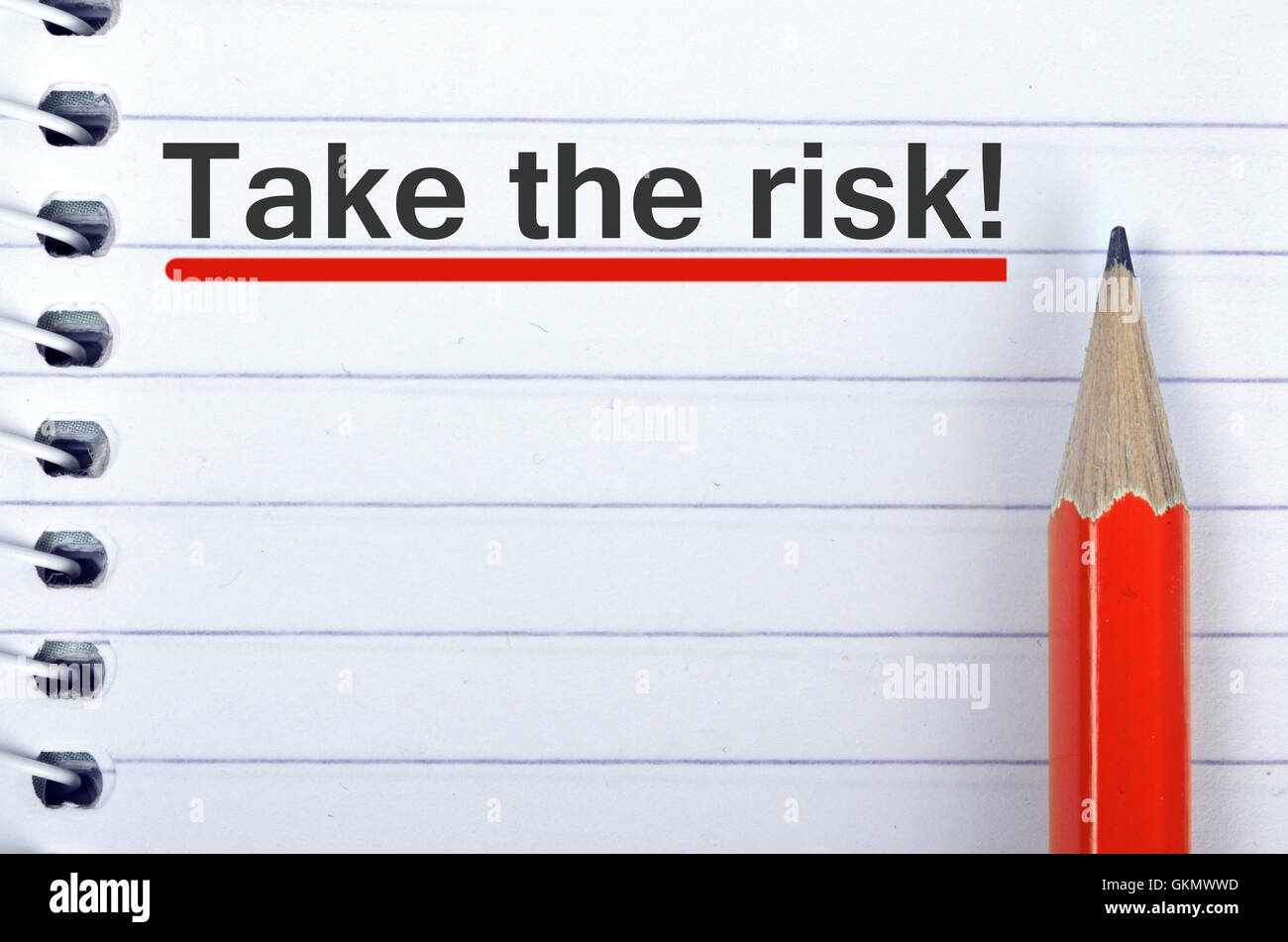 Take the risk text on notepad and red pencil Stock Photo - Alamy