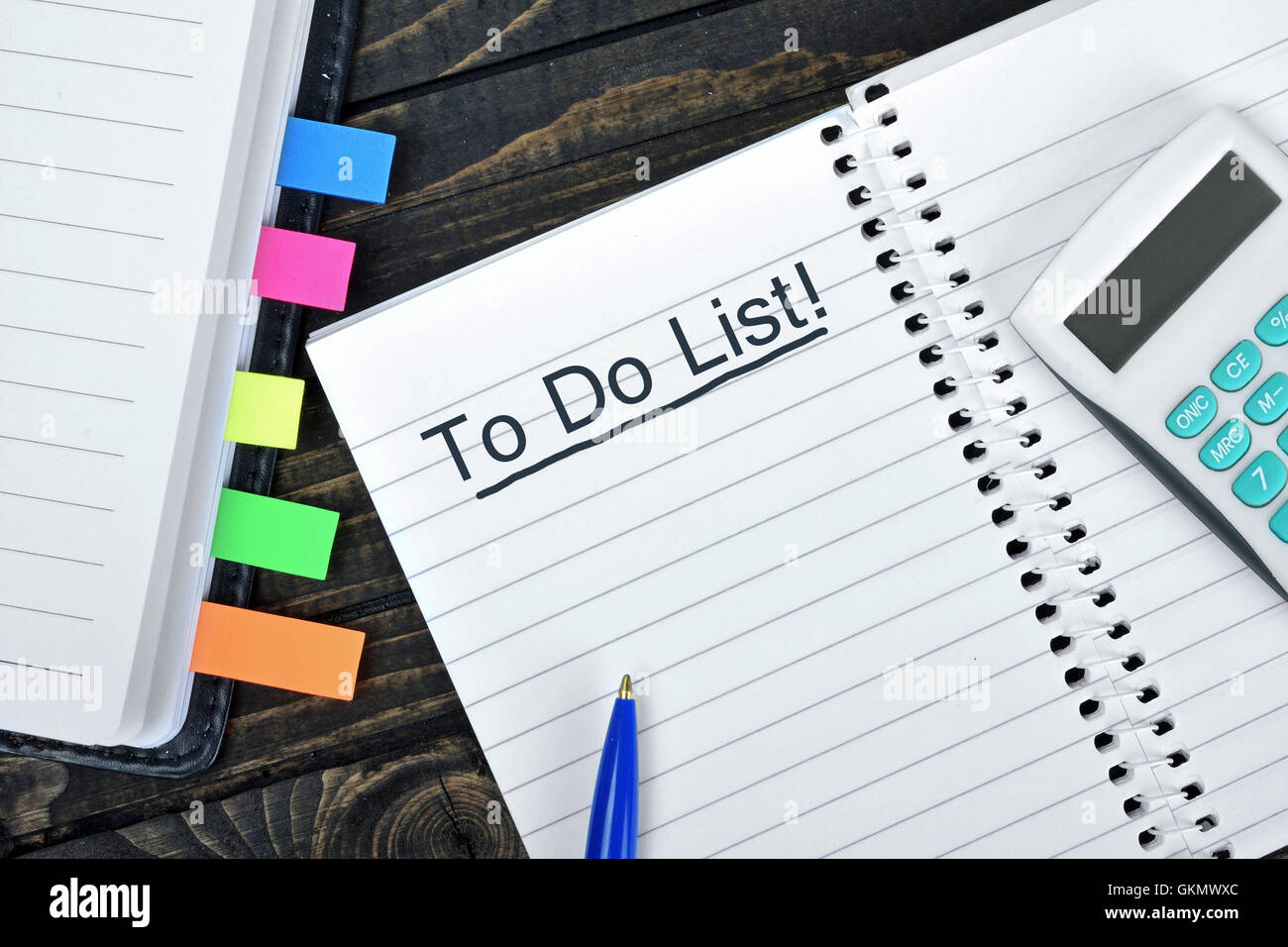 To do list text on notepad and hand calculator Stock Photo - Alamy