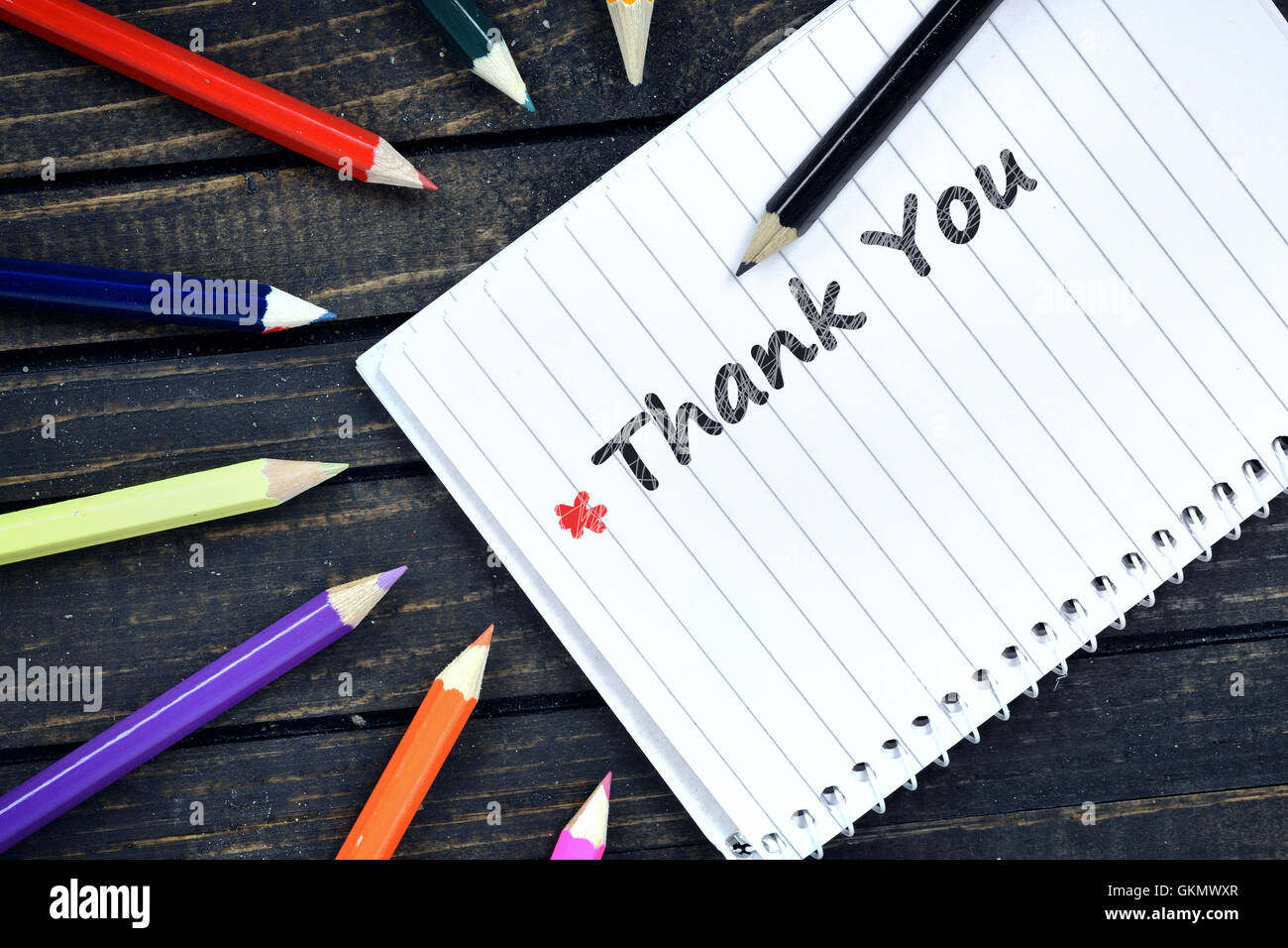 Thank you text on notepad and colorful pencils Stock Photo - Alamy