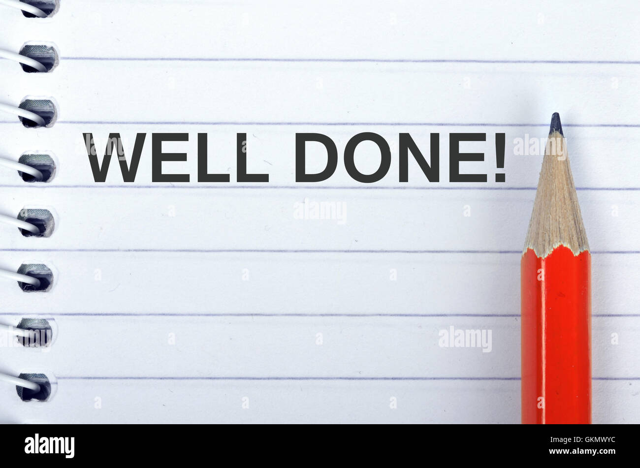 Well Done text on notepad and red pencil Stock Photo - Alamy