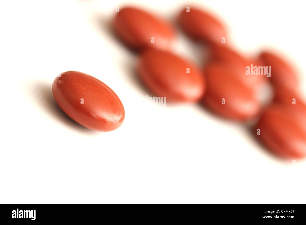 isolated red pills Stock Photo - Alamy