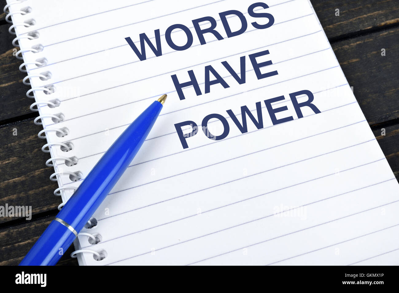 Words have power text on notepad and blue pen Stock Photo - Alamy