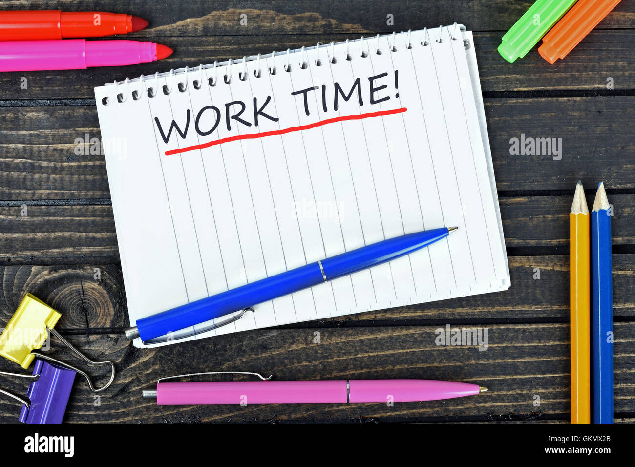 Work time text on notepad and office tools on wooden table Stock Photo ...
