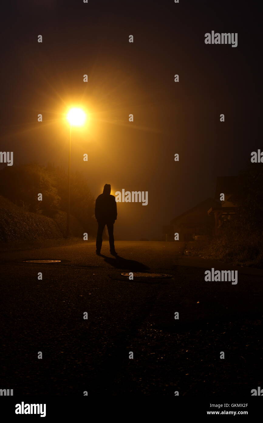 shadow of a man in the night Stock Photo - Alamy