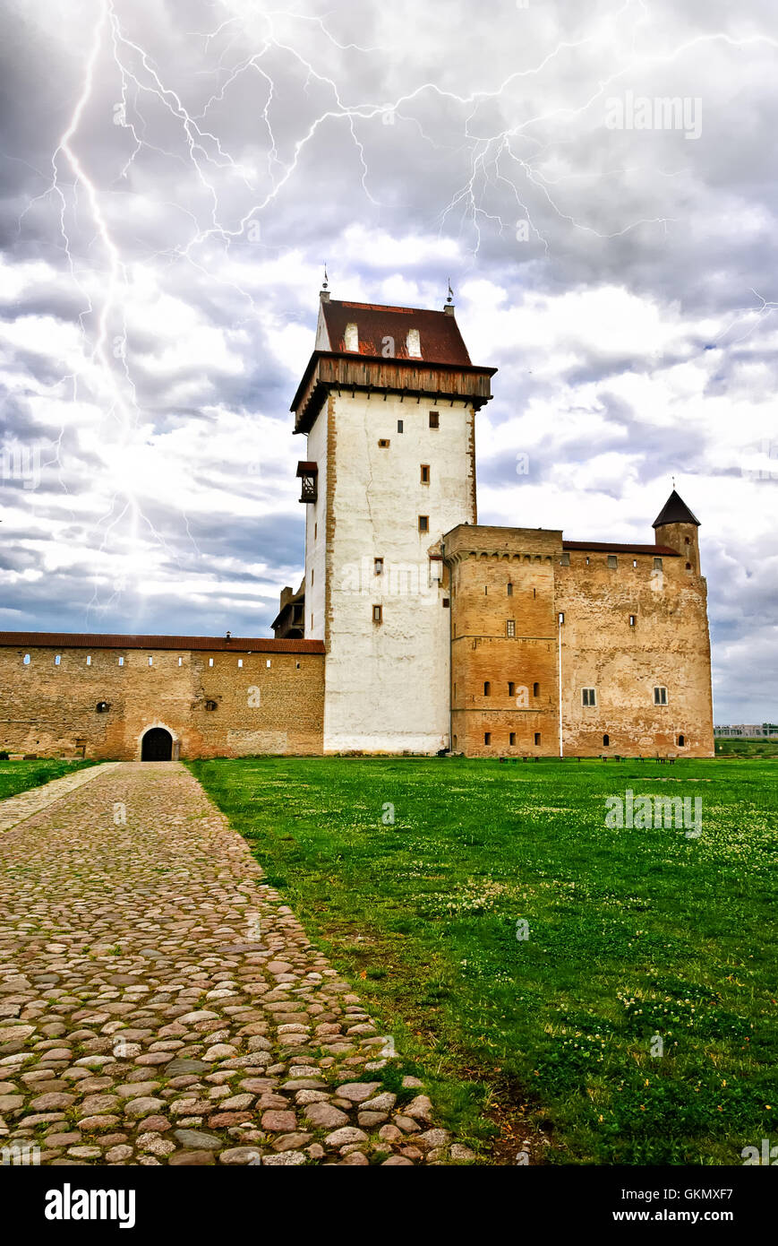 Medieval castle with clouds and lightning Stock Photo - Alamy