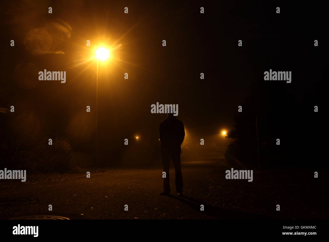 shadow of a man in the night Stock Photo - Alamy