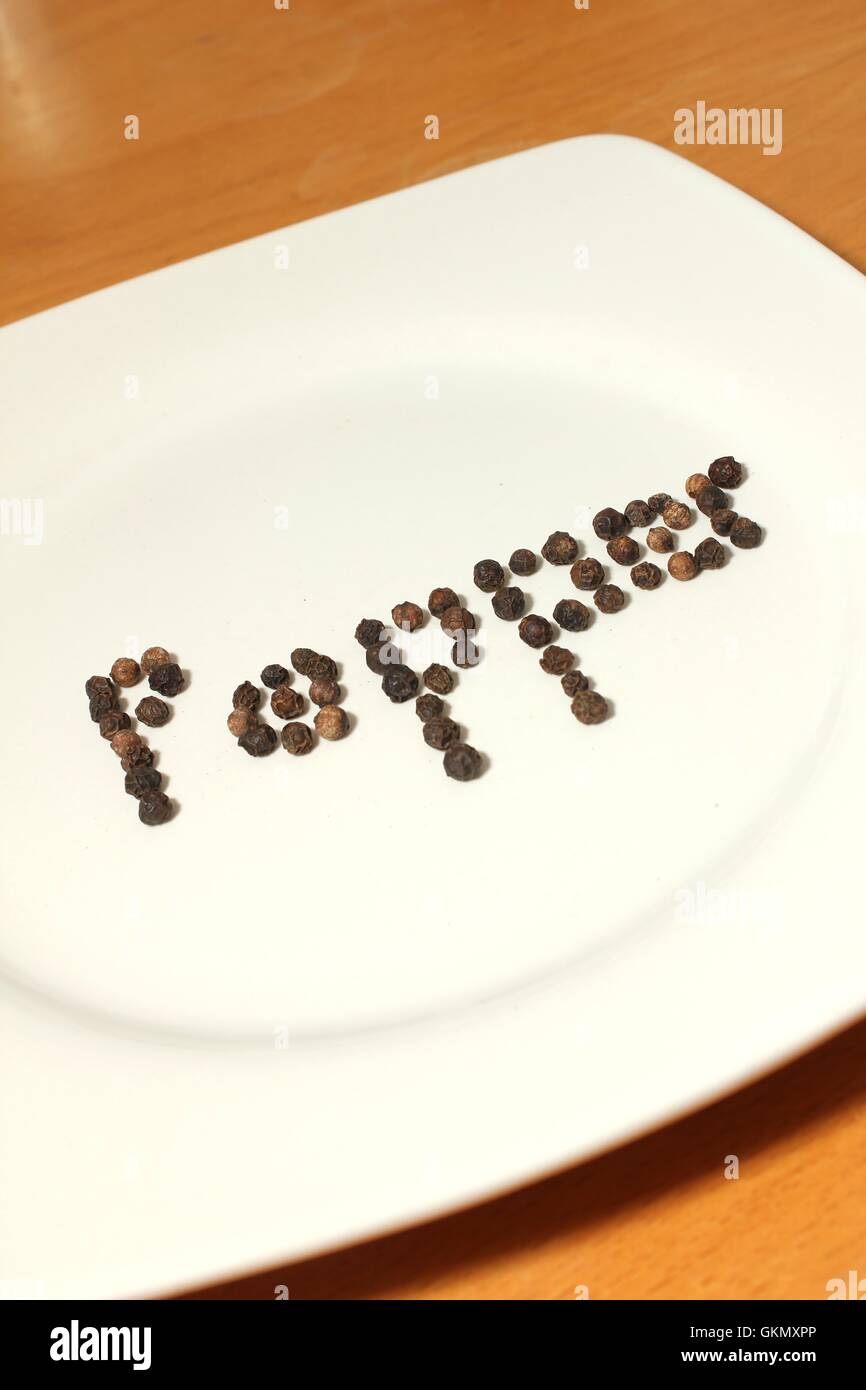 pepper text on a plate Stock Photo - Alamy