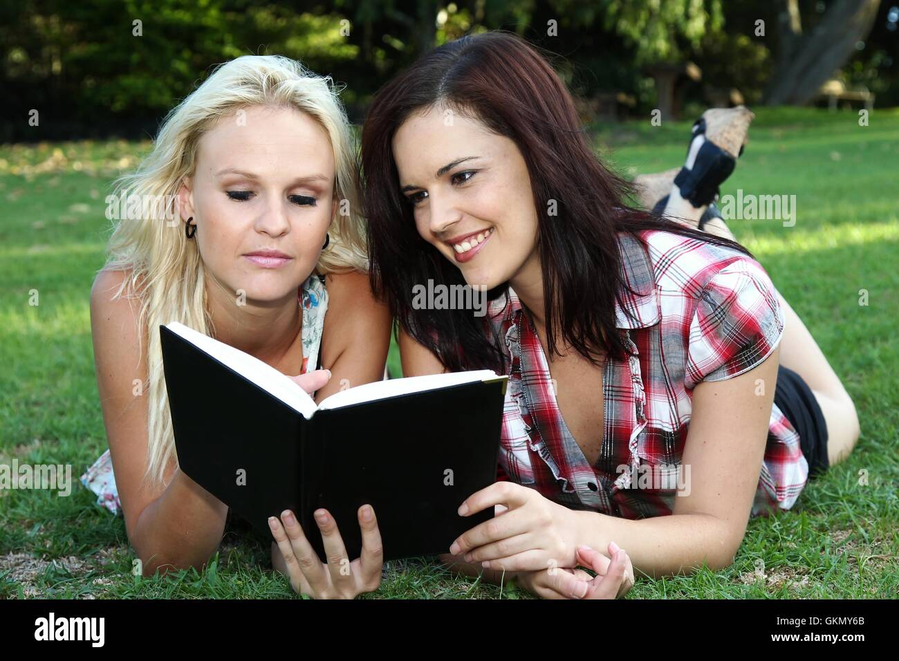 Beautiful Ladies Reading Book Stock Photo - Alamy