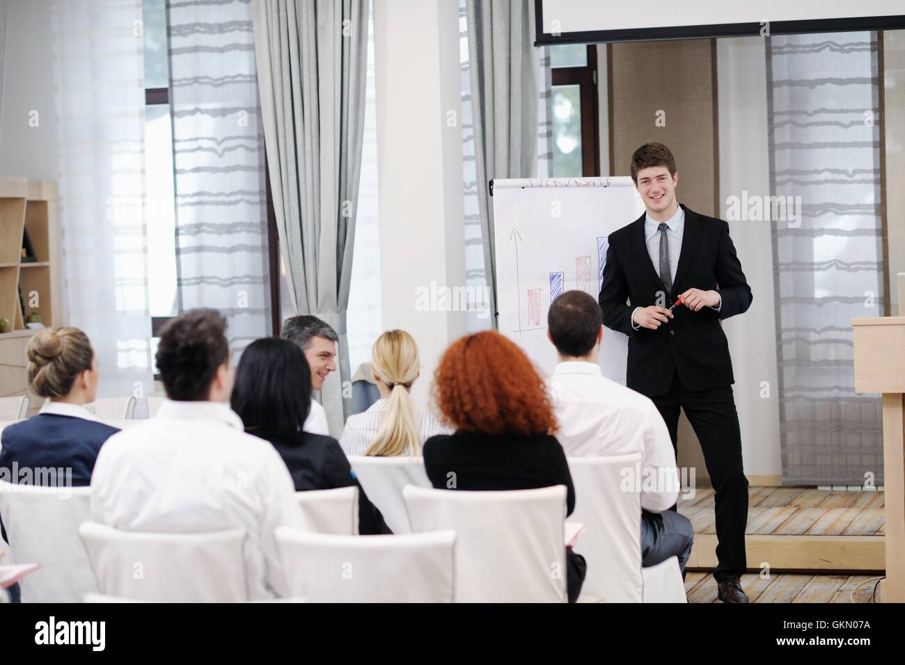 Young business man giving a presentation on conference Stock Photo - Alamy