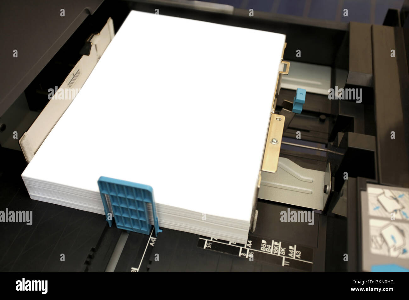 details of inserts a paper A4 into a laser copier Stock Photo - Alamy
