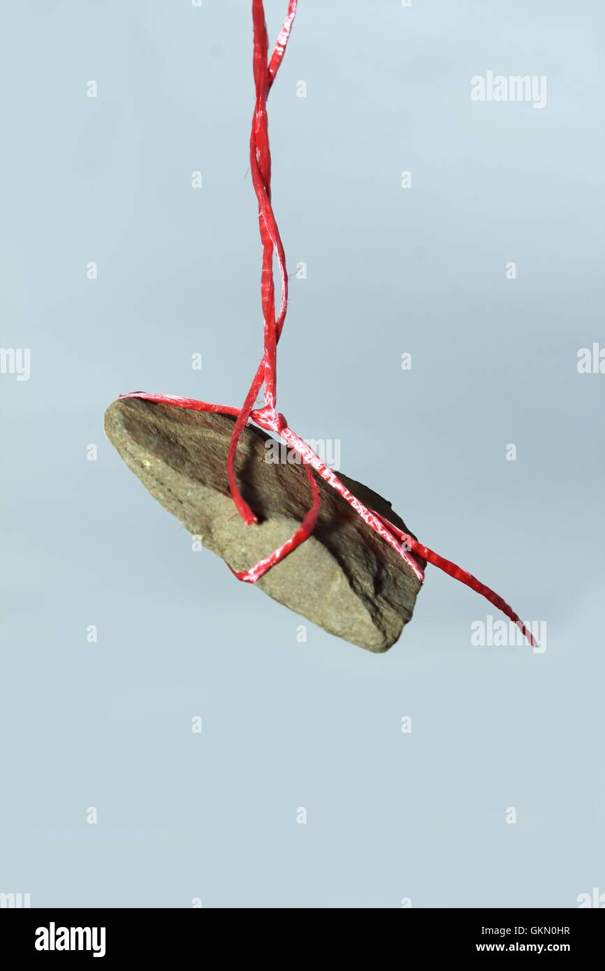 stone rope weight Stock Photo - Alamy