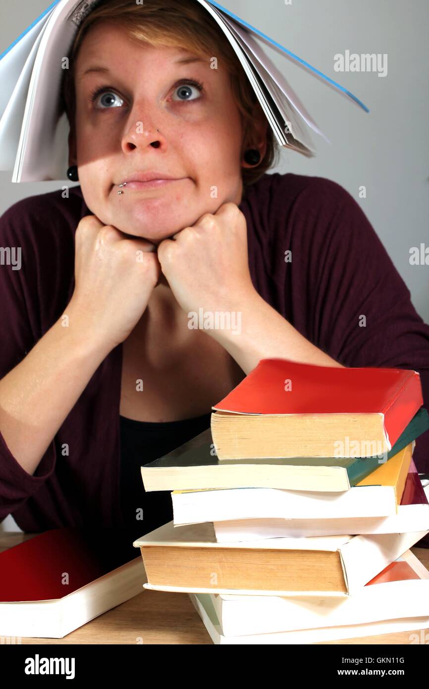 girl with books is thinking Stock Photo - Alamy