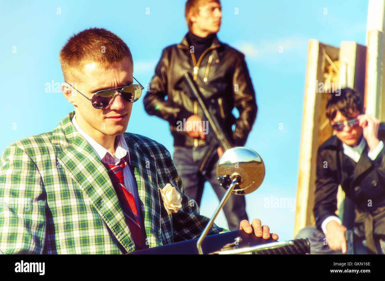 Mafia: Three thugs with a suitcase and weapons Stock Photo - Alamy