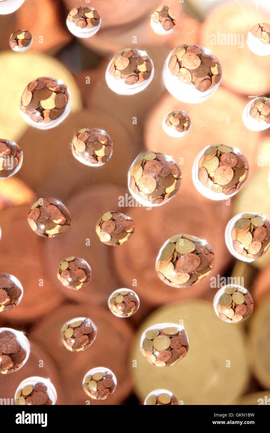 euro coins in water drops Stock Photo - Alamy
