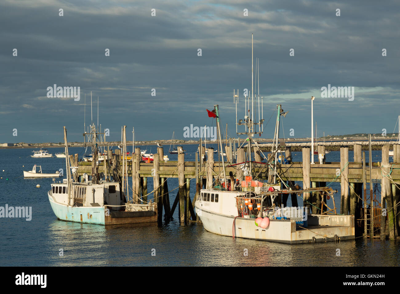A photograph of some fishing boats in Provincetown Harbor, Cape Cod ...