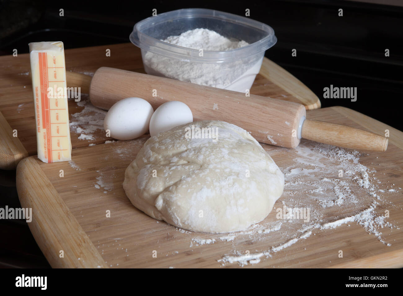 Dough rolling pin butter wood chopping board Stock Photo - Alamy
