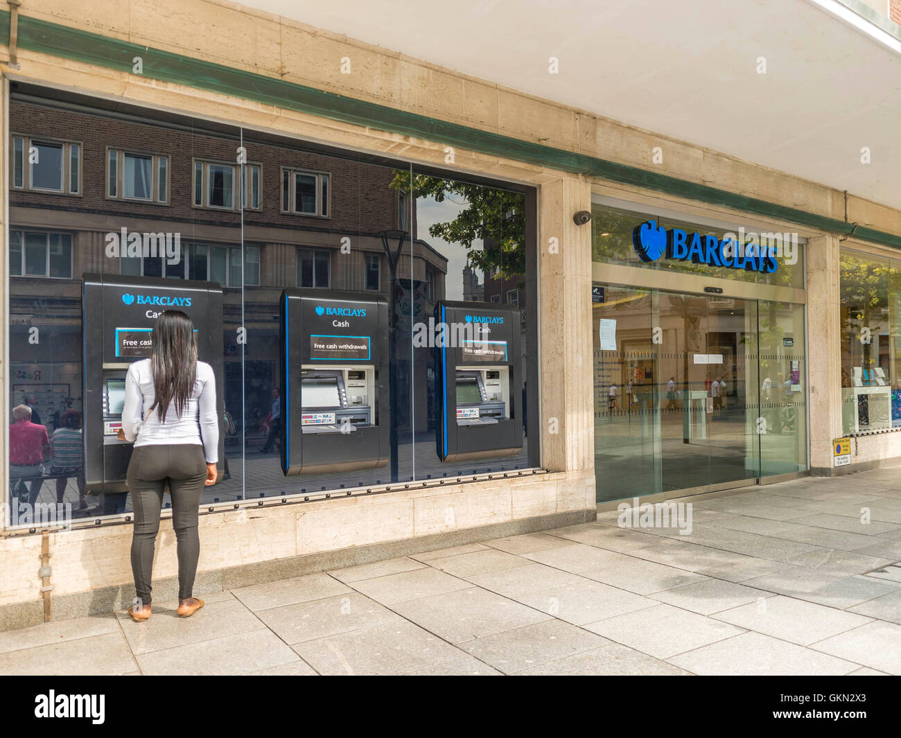 Barclay's Bank, Exeter City Centre, Devon, single female at cash point ...
