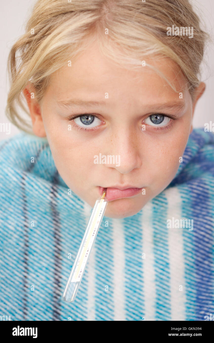 Sick girl with fever Stock Photo - Alamy