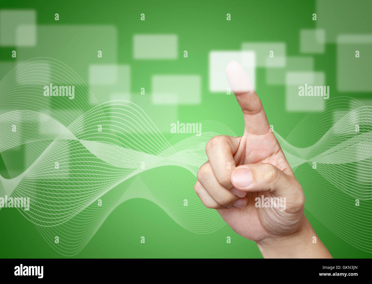 The hand press the button on green background Stock Photo - Alamy