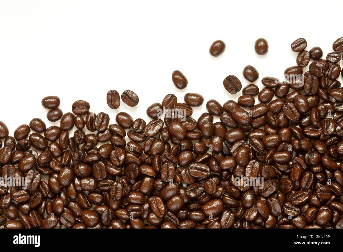 many coffee beans on white background Stock Photo - Alamy