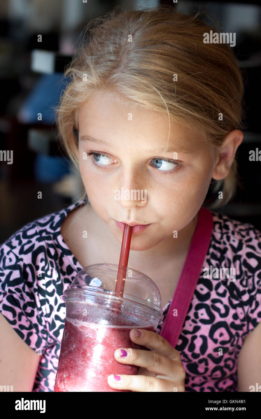 Girl drinking smoothie Stock Photo - Alamy