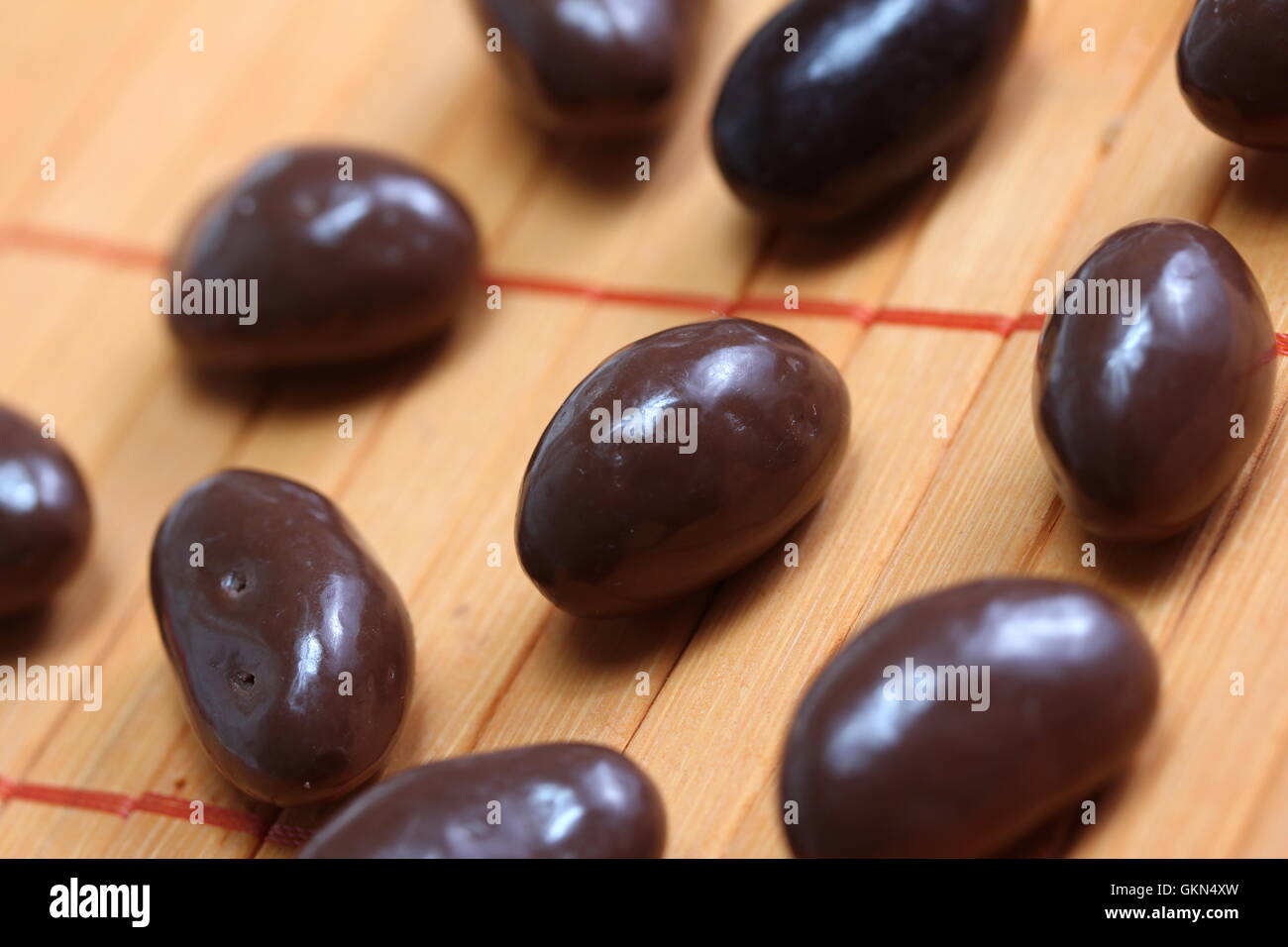macadamia nuts covered with chocolate Stock Photo - Alamy