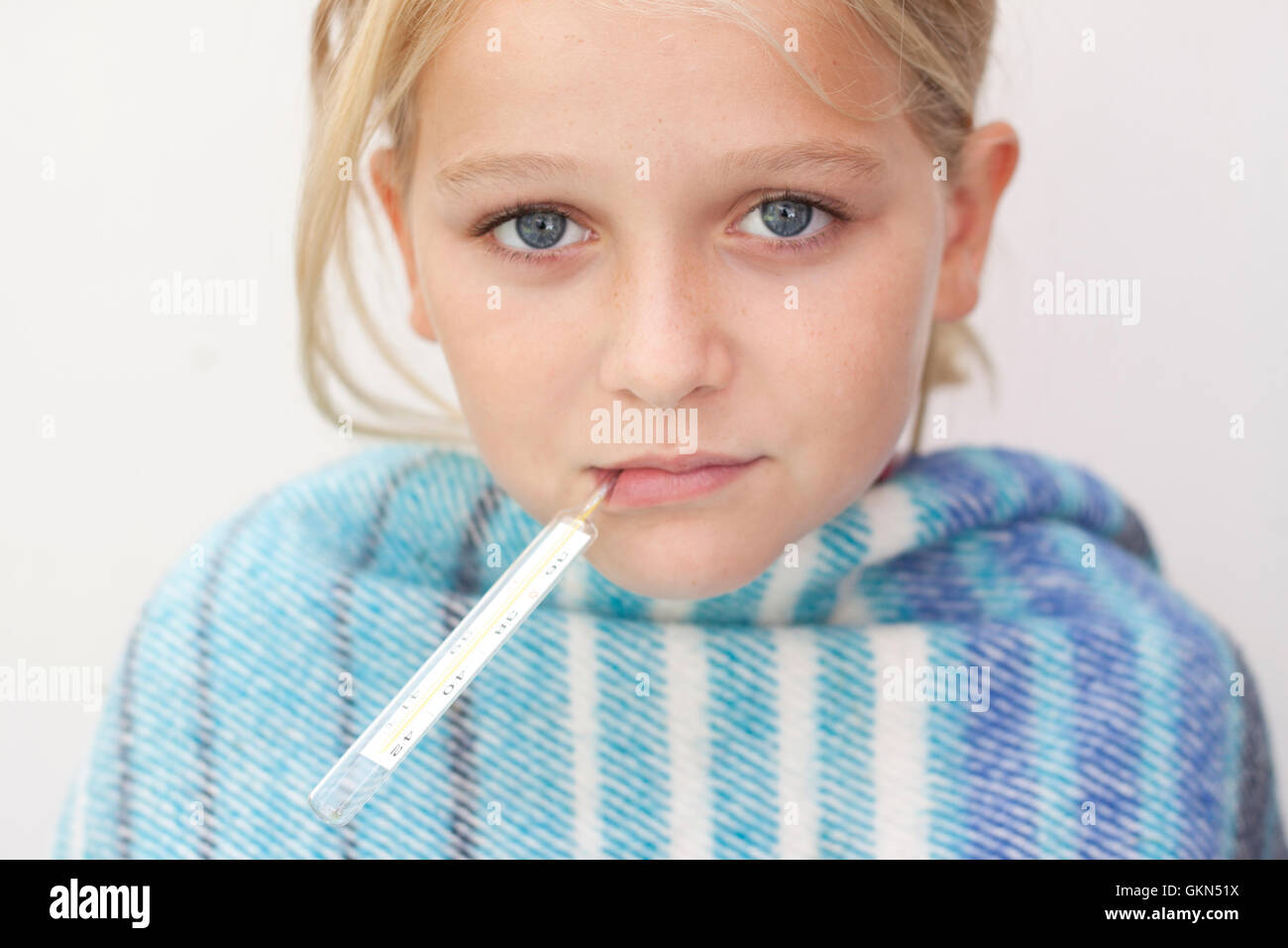 Sick girl with fever Stock Photo - Alamy