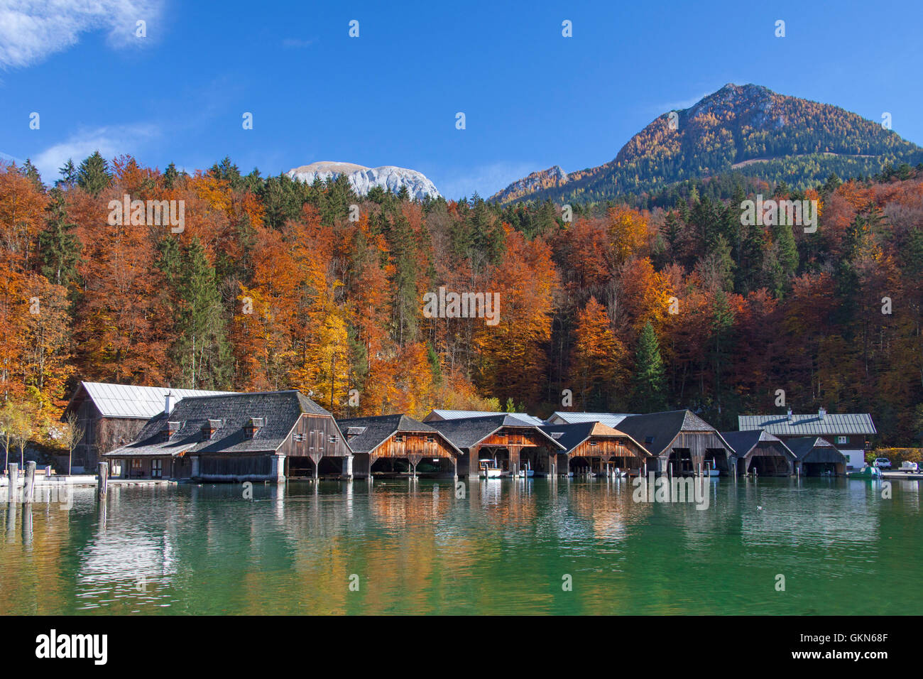 Wooden boathouses along Königssee / Kings lake in autumn, Berchtesgaden ...