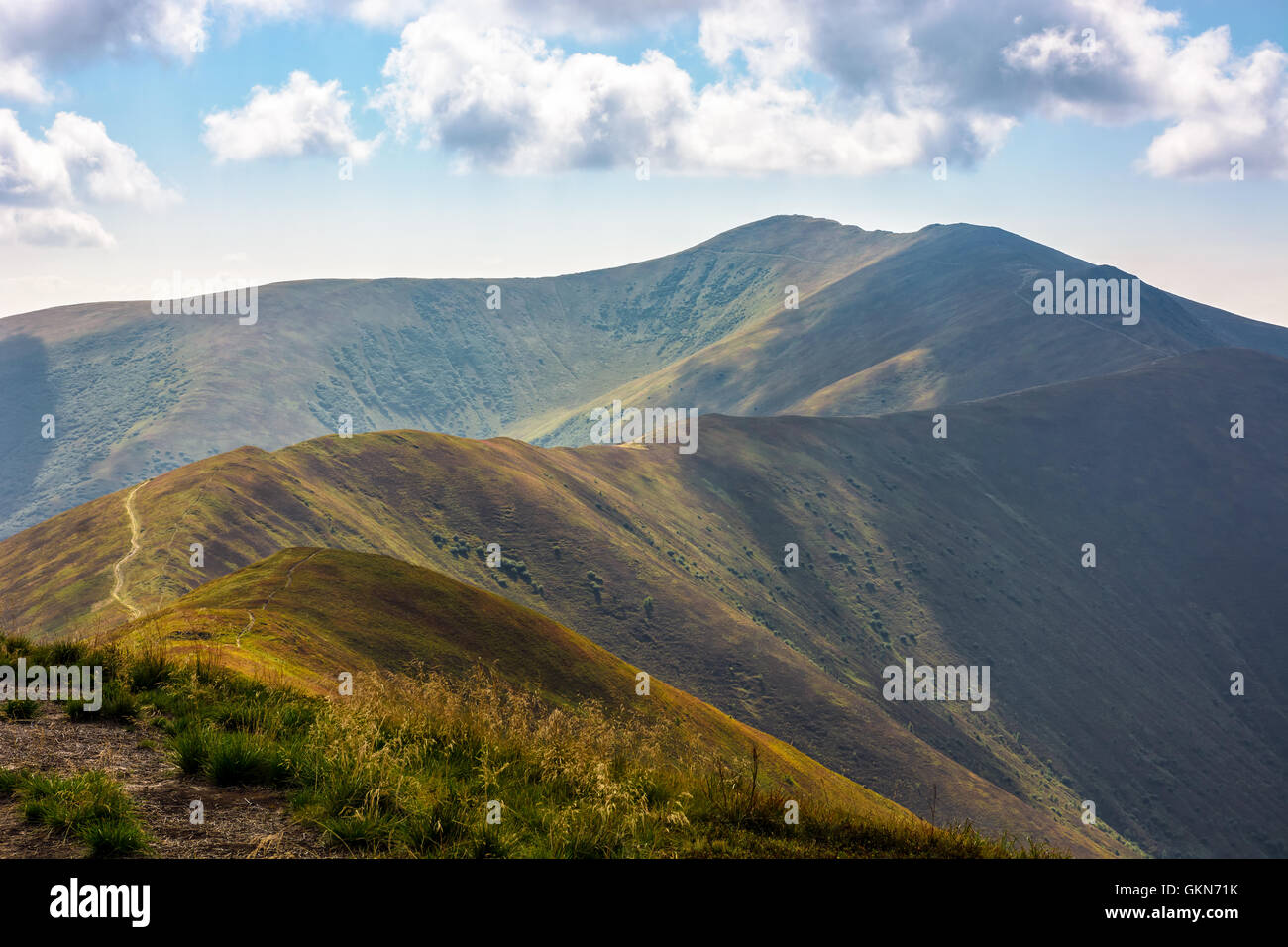 mountain landscape. travers path through hill side to the mountain top ...