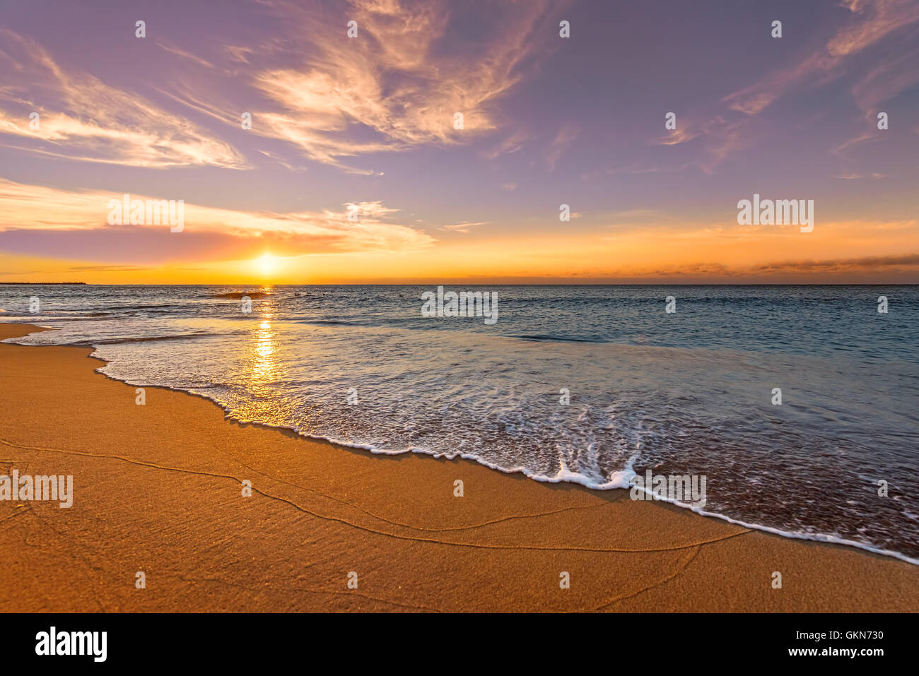 Colorful ocean beach sunrise Stock Photo - Alamy