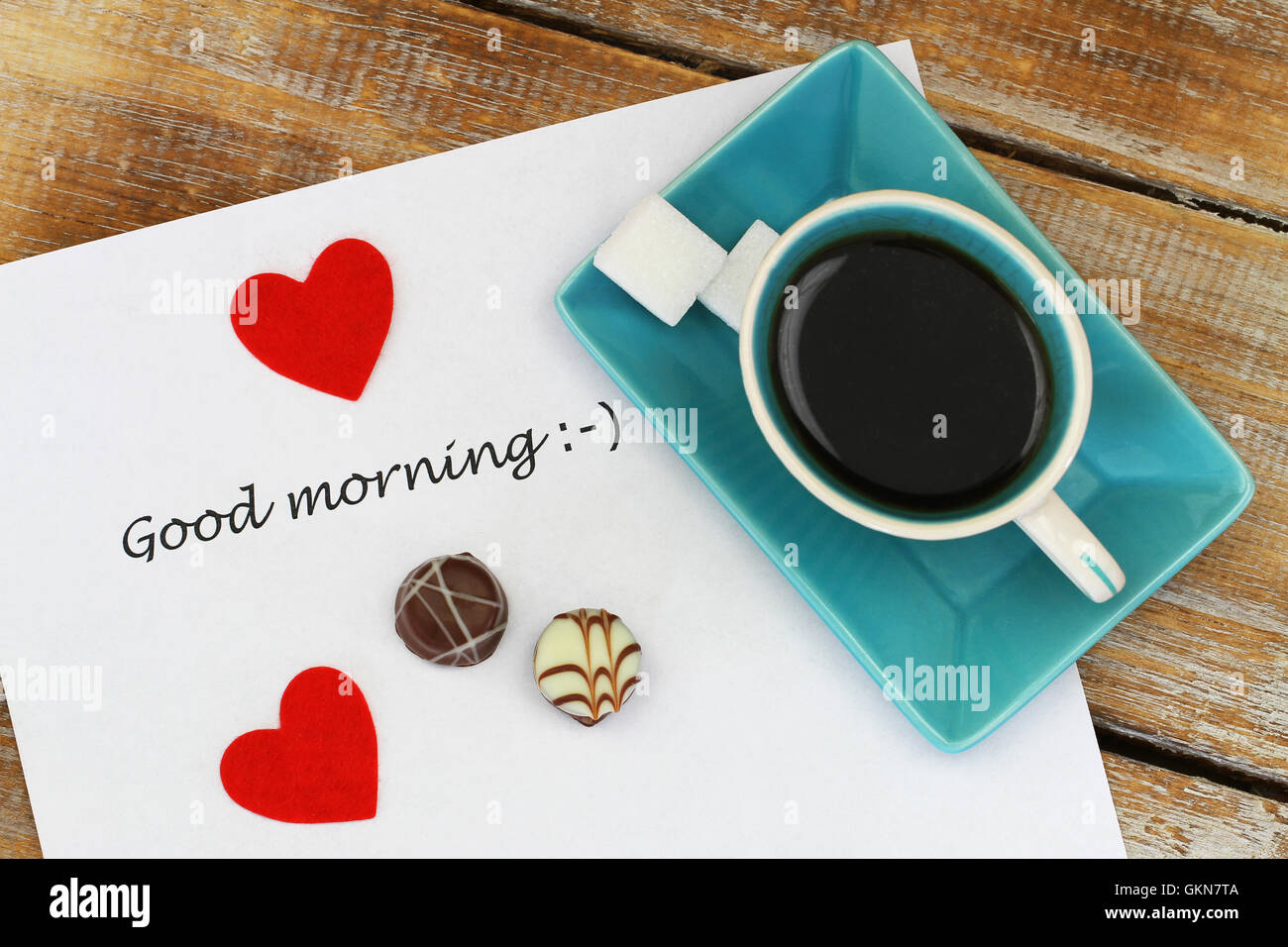 Good morning written on white paper with red hearts and round ...