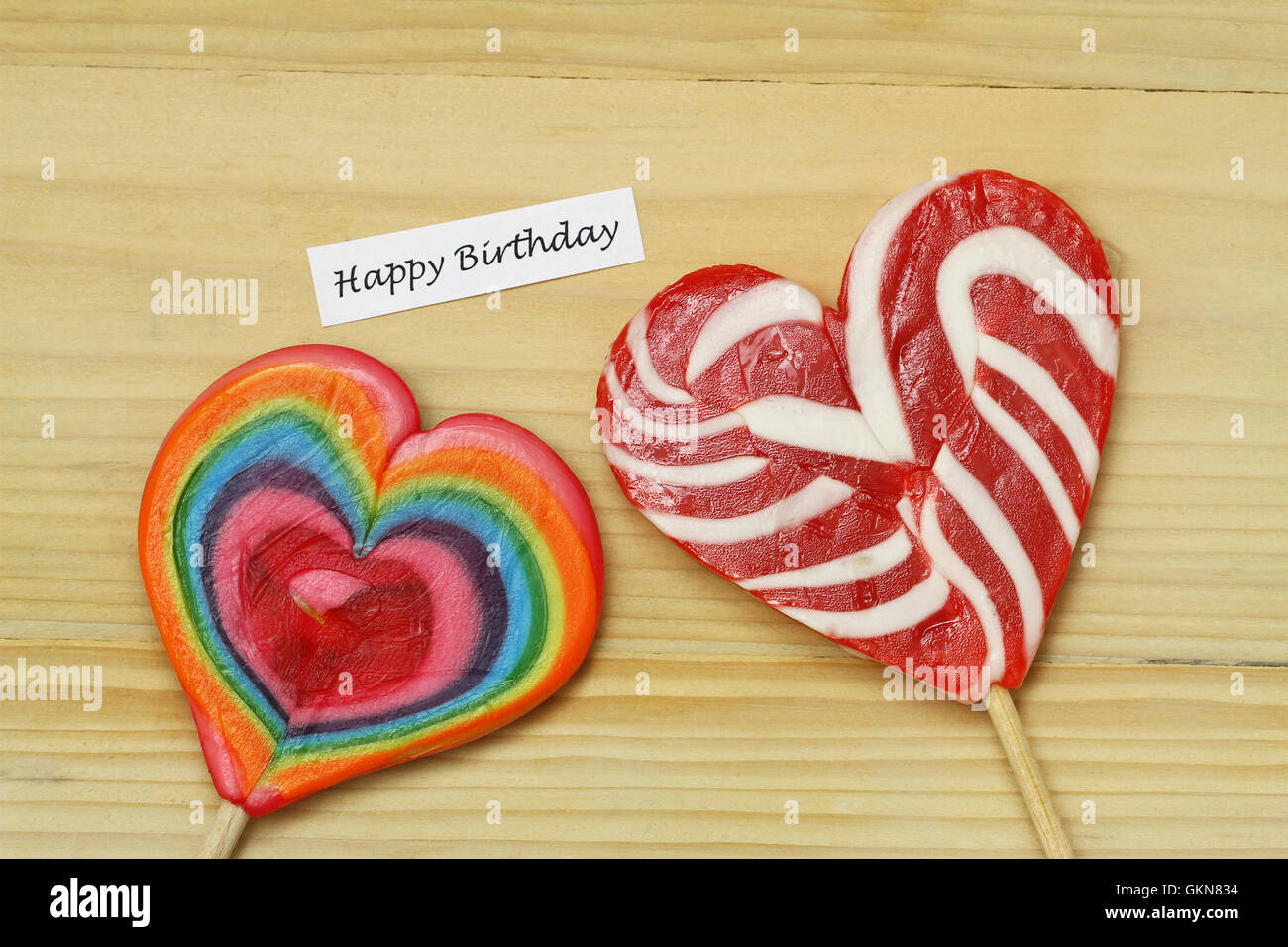 Happy Birthday card with two colorful lollipops on wooden surface Stock ...
