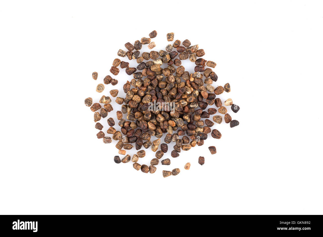 Decorticated cardamom seeds pile on a white background Stock Photo - Alamy