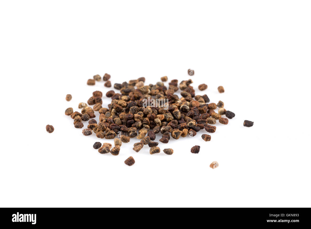 Decorticated cardamom seeds pile on a white background Stock Photo - Alamy