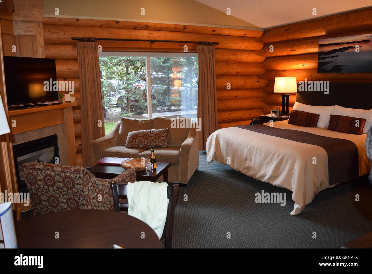 Room in log cabin Stock Photo - Alamy