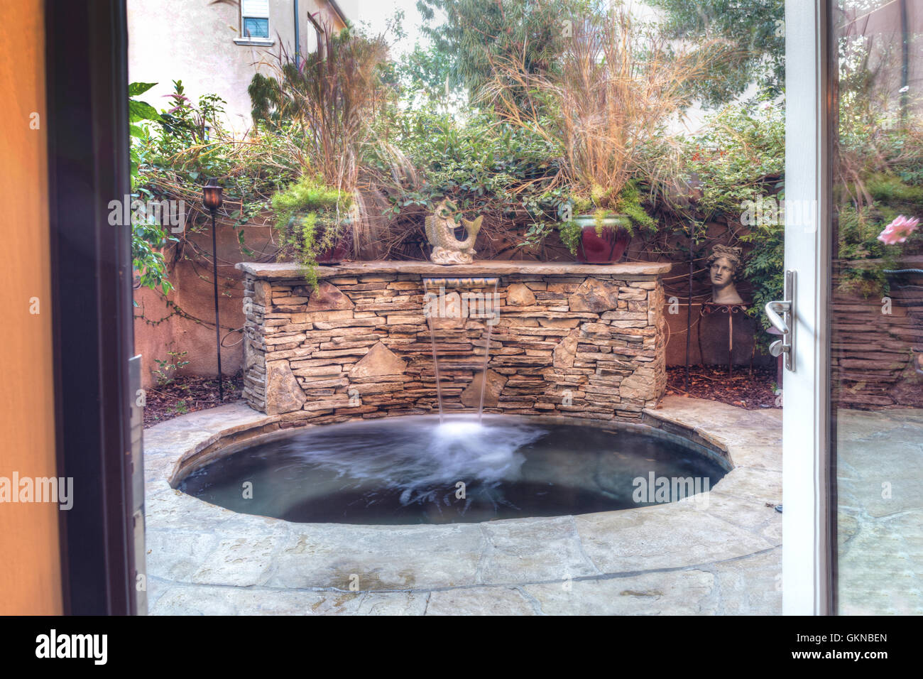 Irvine, CA, USA – August 19, 2016: Oval hot tub spa with waterfall and ...