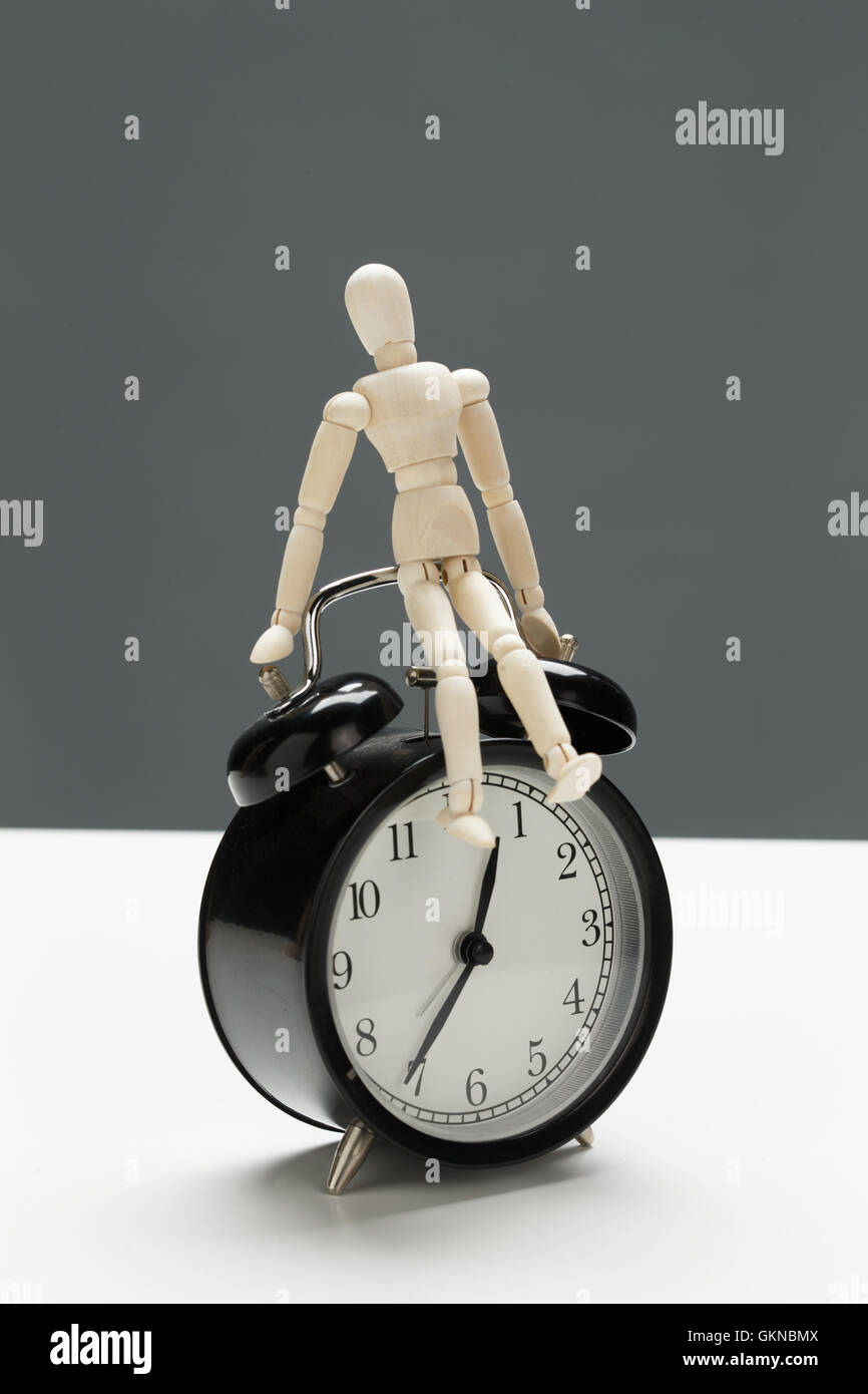 Puppet and alarm clock Stock Photo - Alamy