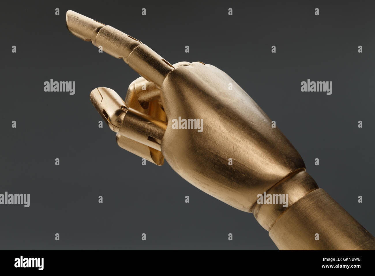 Gold hand pointing index finger hi-res stock photography and images - Alamy