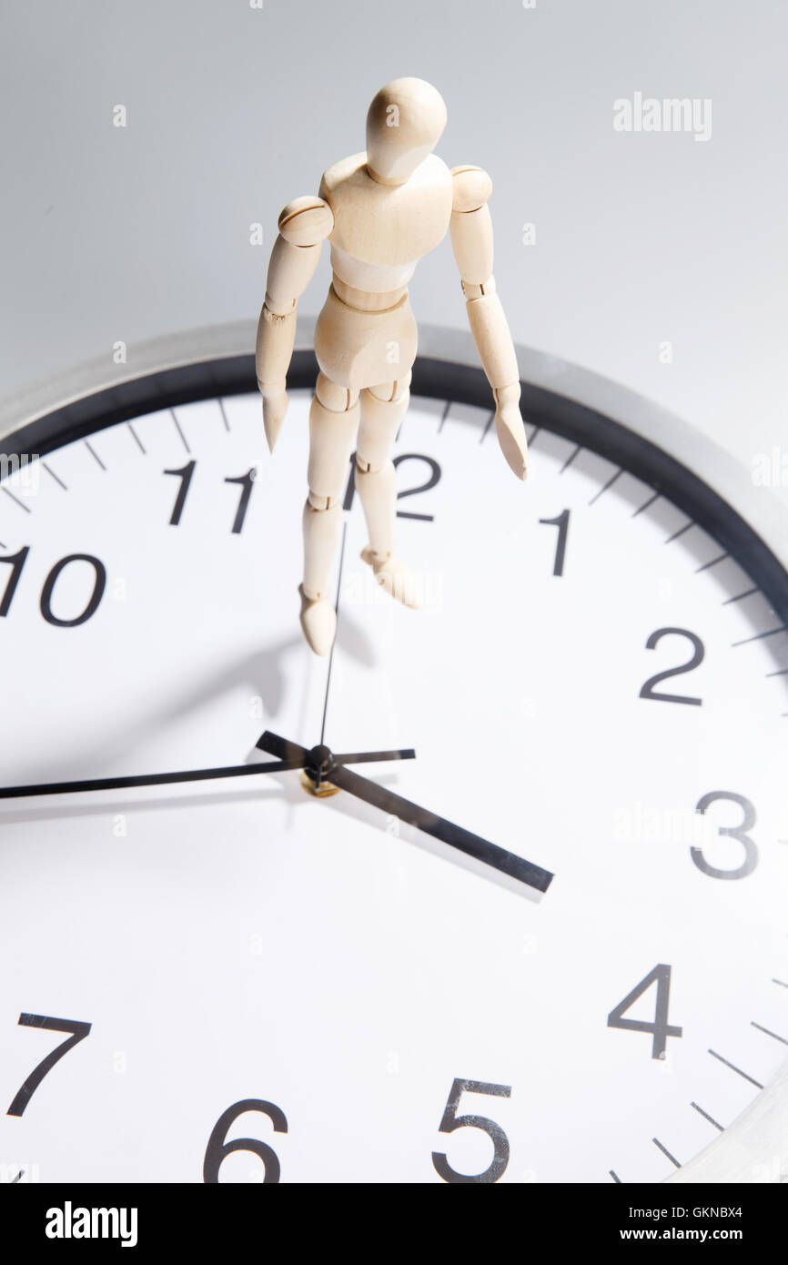 Puppet and alarm clock Stock Photo - Alamy