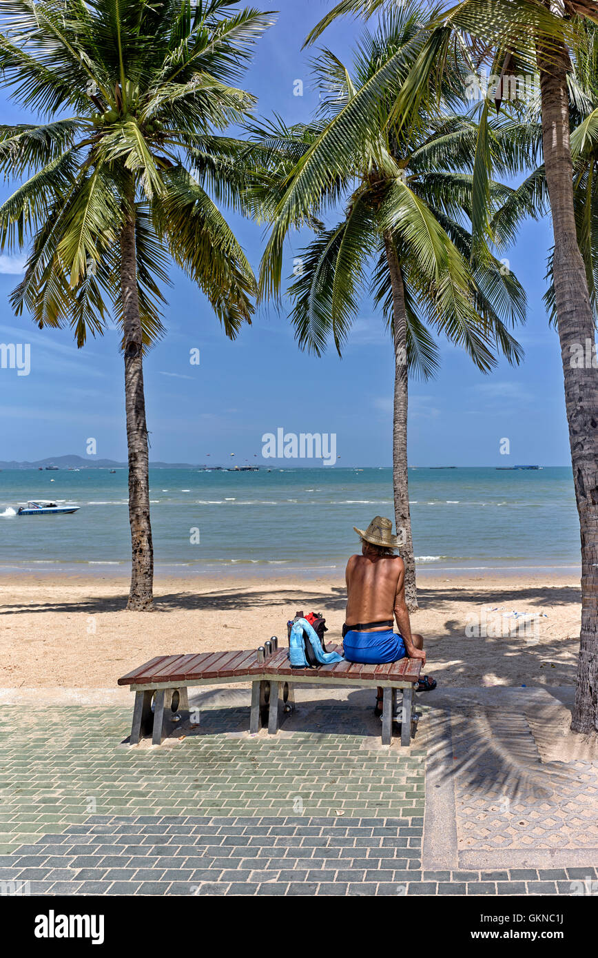 Man overlooking tropical ocean at Pattaya beach Thailand S. E. Asia ...
